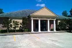 The front and parking space of Bayou Federal Credit Union.